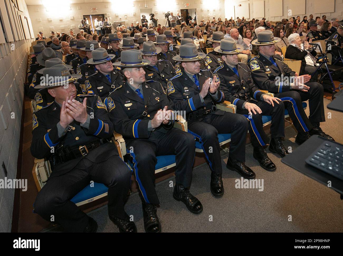 State Police Troopers applaud before being promoted during the ...