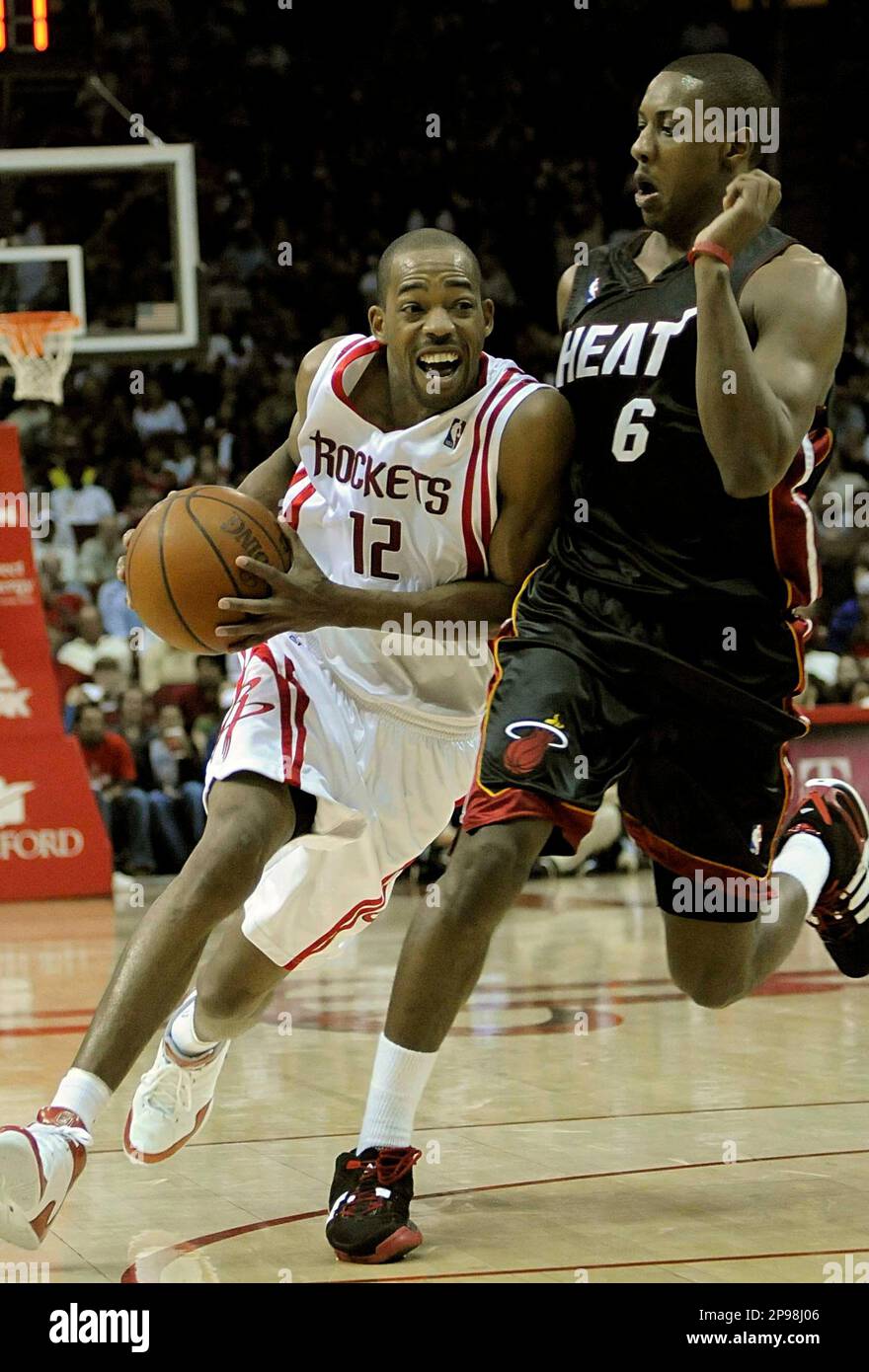 Houston Rockets' Rafer Alston (12) goes for the basket against Miami ...