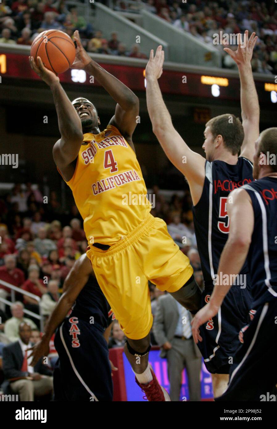 Southern California's Leonard Washington shoots the ball over Arizona's ...