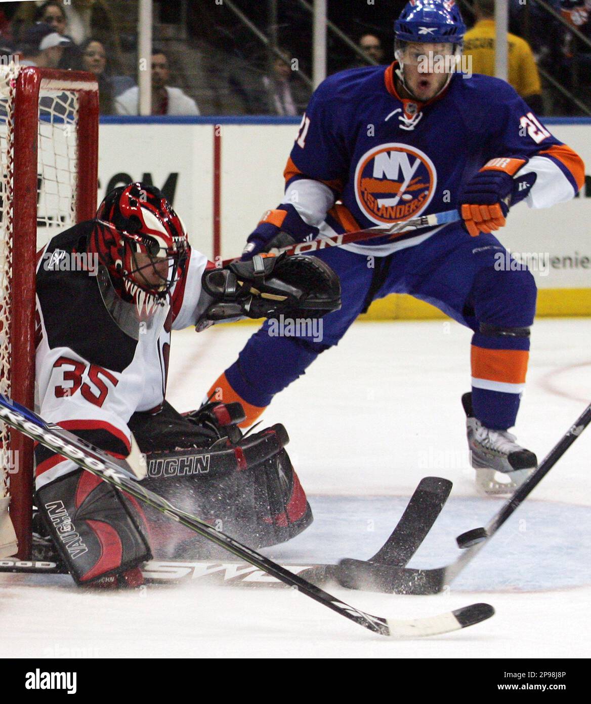 New Jersey Devils goalie Scott Clemmensen stops a shot as New York ...
