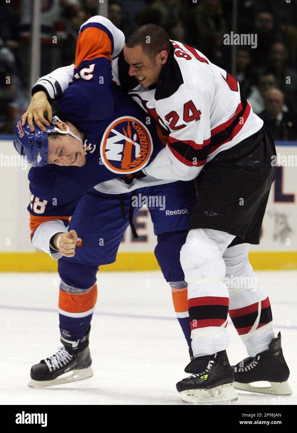 New Jersey Devils' Bryce Salvador (24) fights New York Islanders' Tim ...