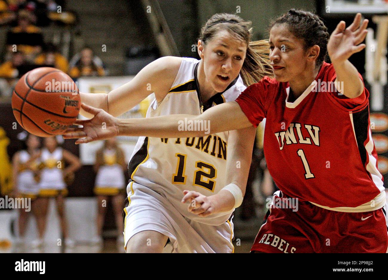 UNLV guard Dominique Harris. right, knocks the ball away from Wyoming ...