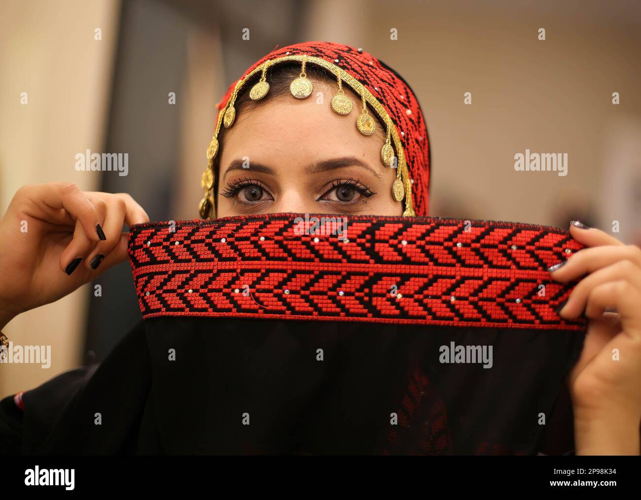 Gaza, Palestine. 9th Mar, 2023. A Palestinian young lady wearing a ...