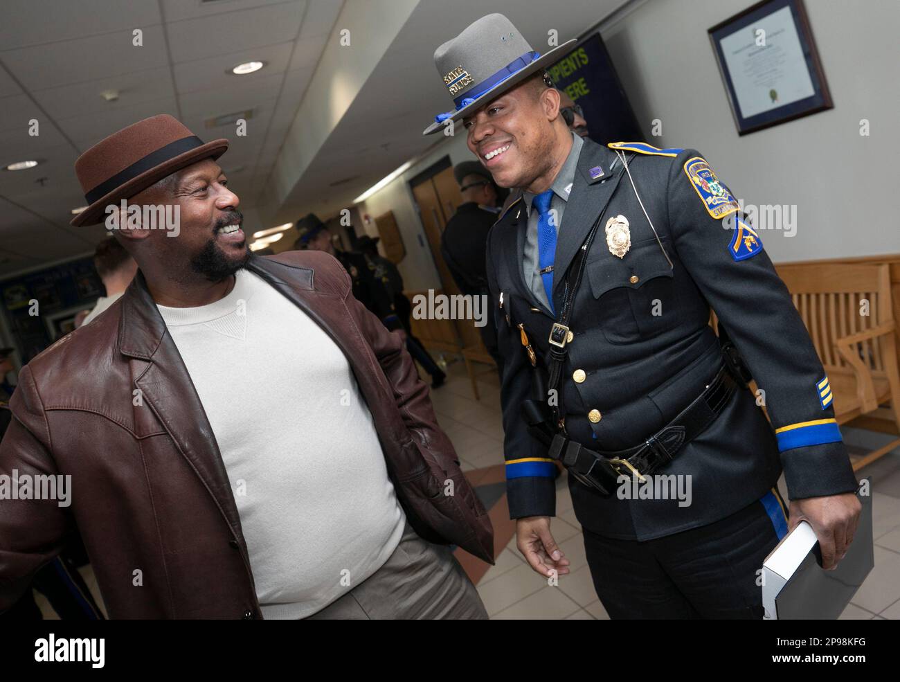 CT State Police Sgt. Jamie Sanders, of Meriden, right, smiles with friend and retired State ...
