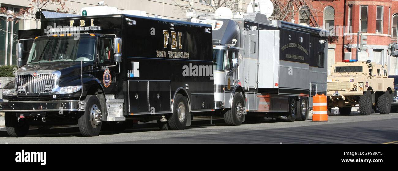 Three the FBI’s tactical response vehicles are seen at the Washington ...
