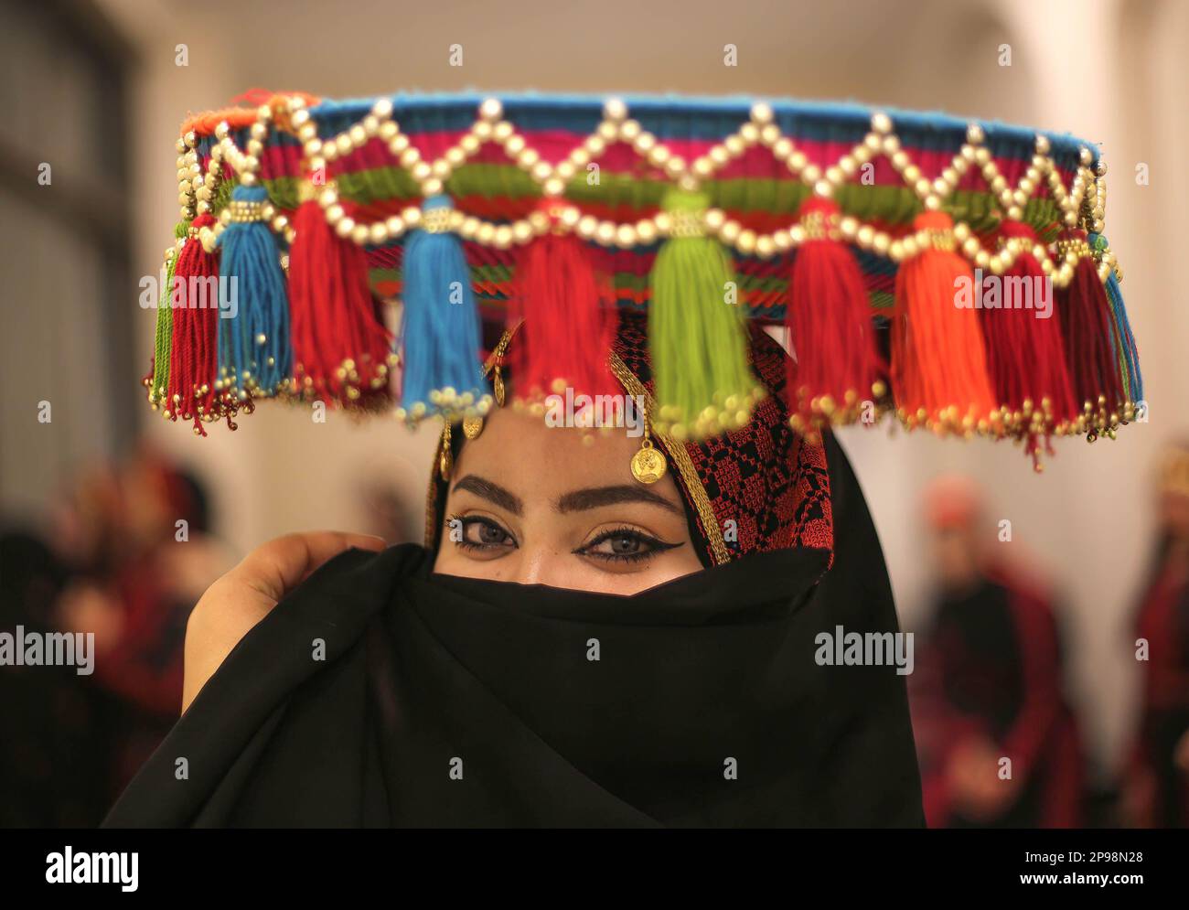 Gaza, Palestine. 9th Mar, 2023. A Palestinian young lady wearing a ...