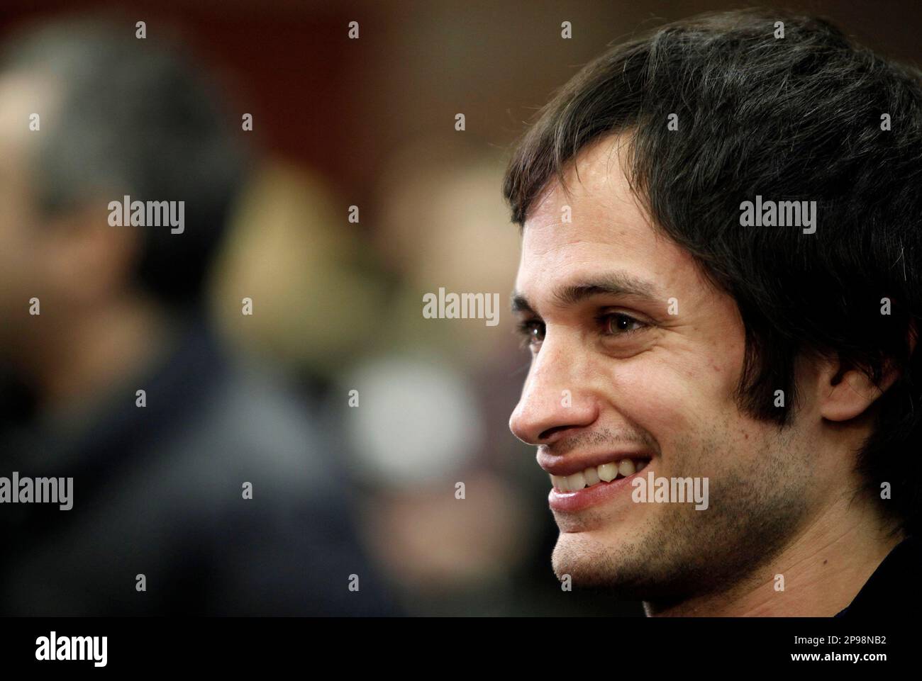 Gael Garcia Bernal smiles as he arrives at the premiere of "Rudo Y ...