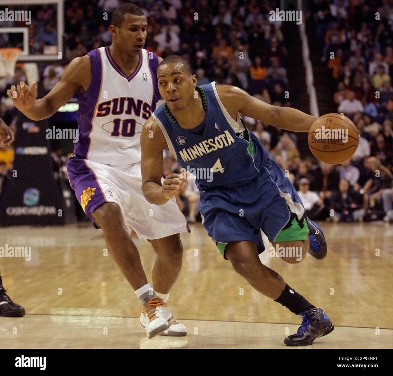 Minnesota Timberwolves guard Randy Foye, right, dribbles around Phoenix ...