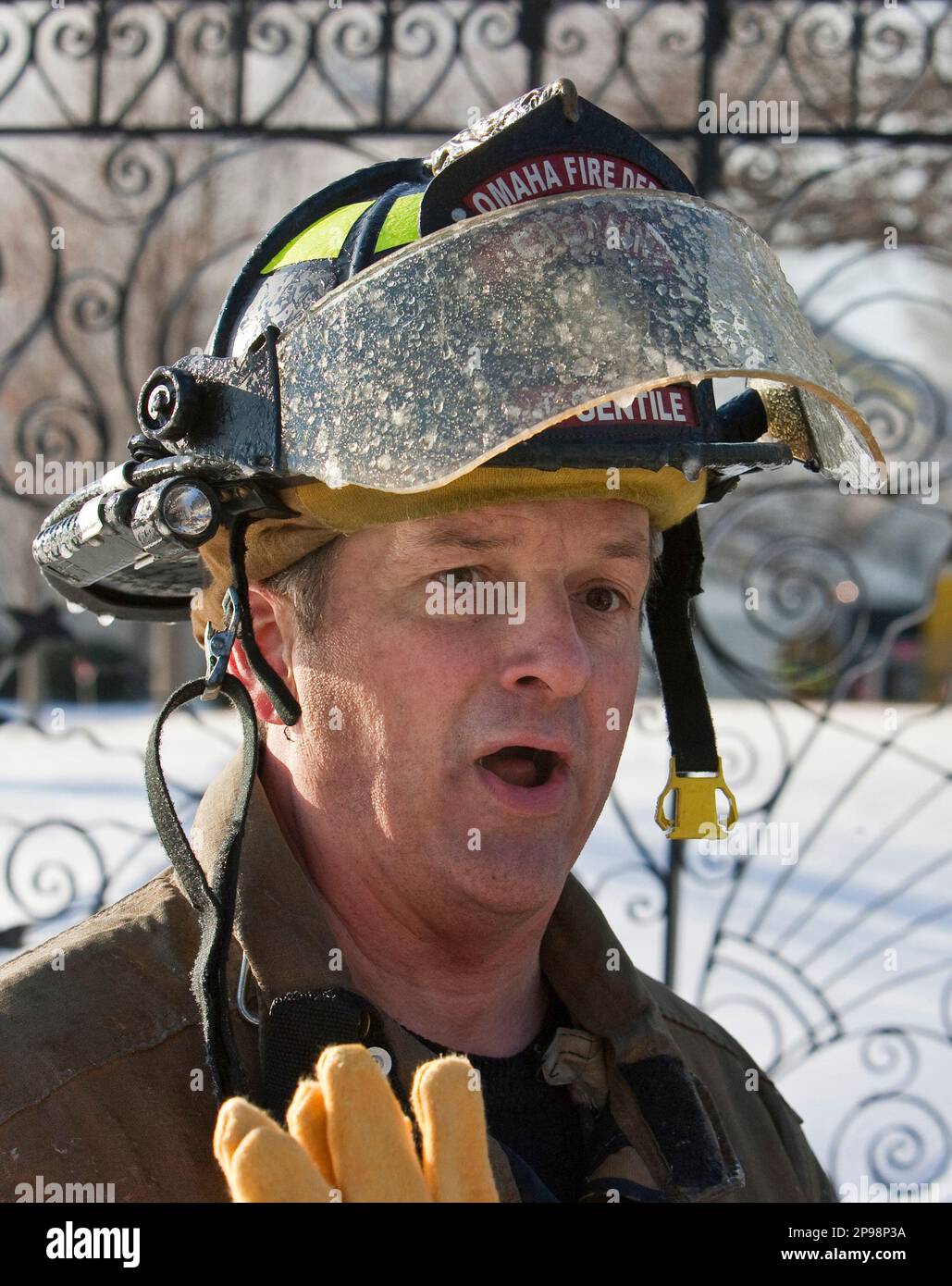 Omaha fire Department Captain Jim Gentile's visor and helmet are ...
