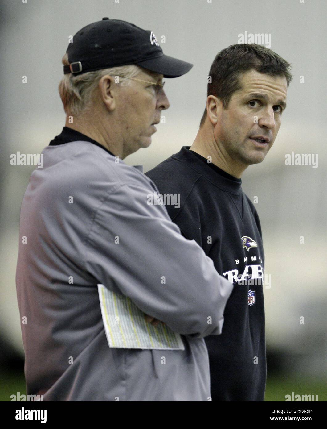 Baltimore Ravens offensive coordinator Cam Cameron, left, and head ...