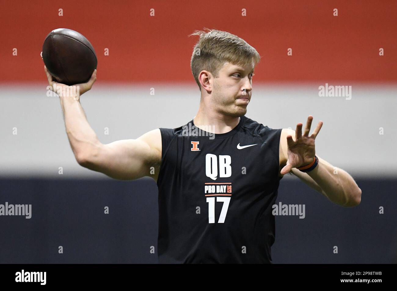 Former Illinois player Ryan Johnson (17) passes during a position drill at Illinois' NFL Pro Day ...