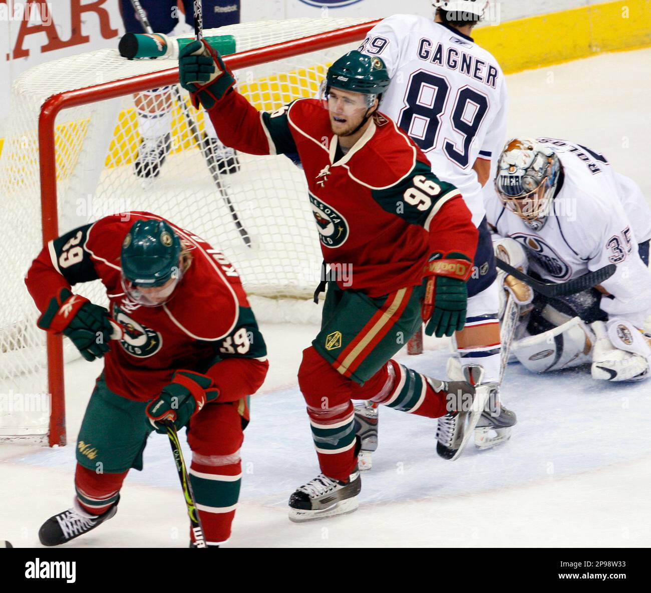 Minnesota Wild center Krystofer Kolanos (39) and center Pierre-Marc ...