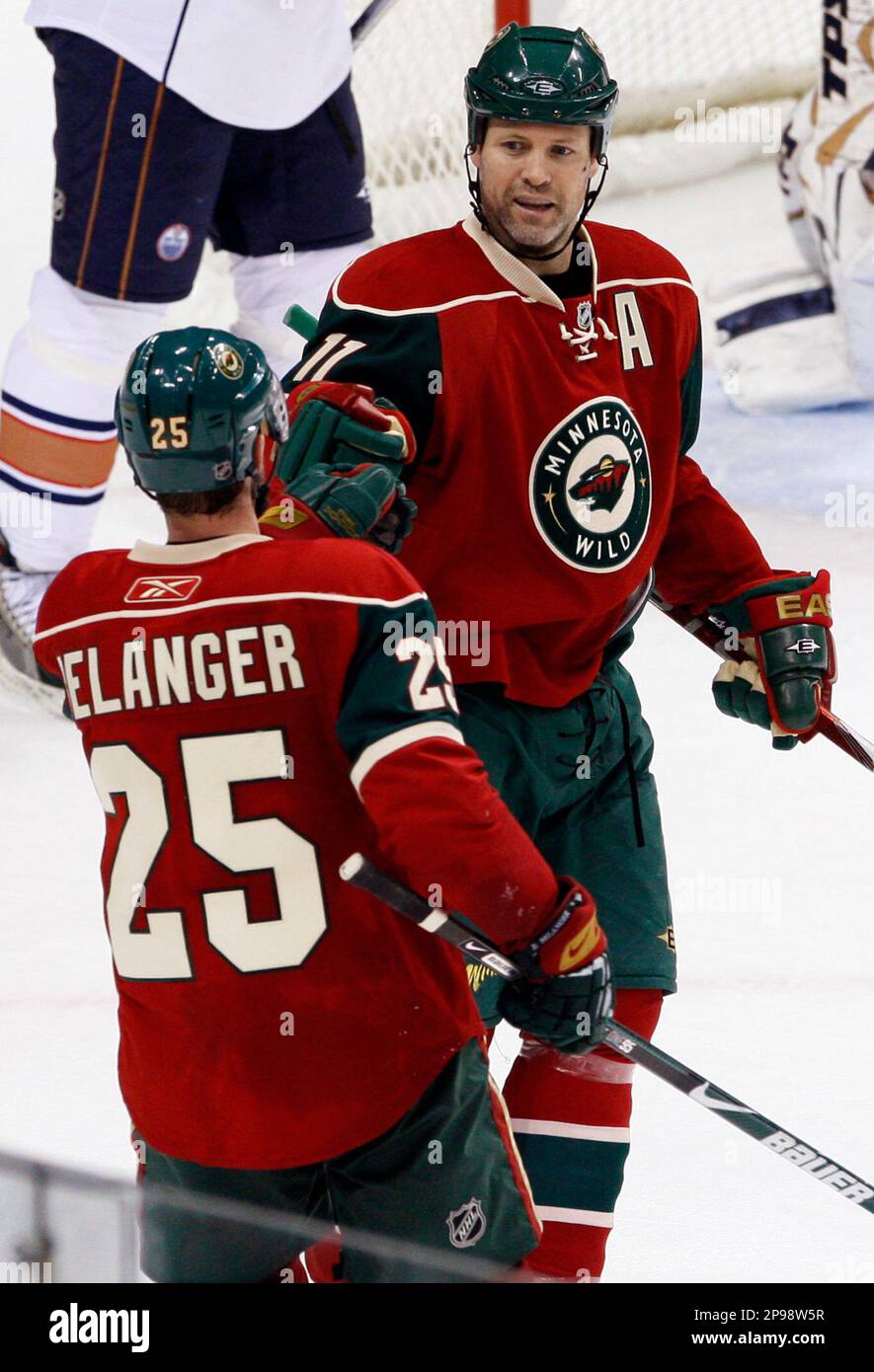 Minnesota Wild right wing Owen Nolan, right, of Ireland, congratulates ...