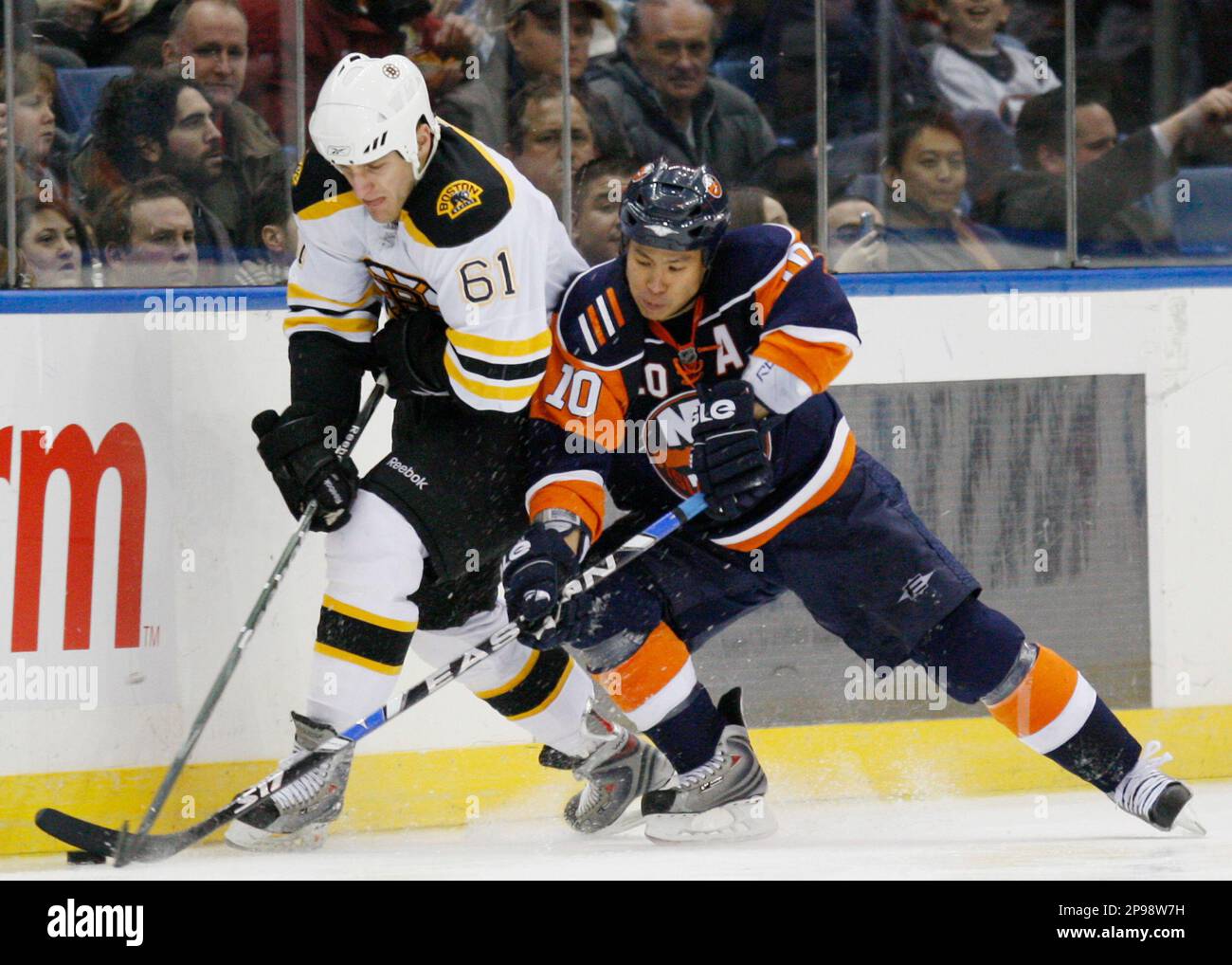 Boston Bruins' Byron Bitz, left, battles New York Islanders' Richard ...