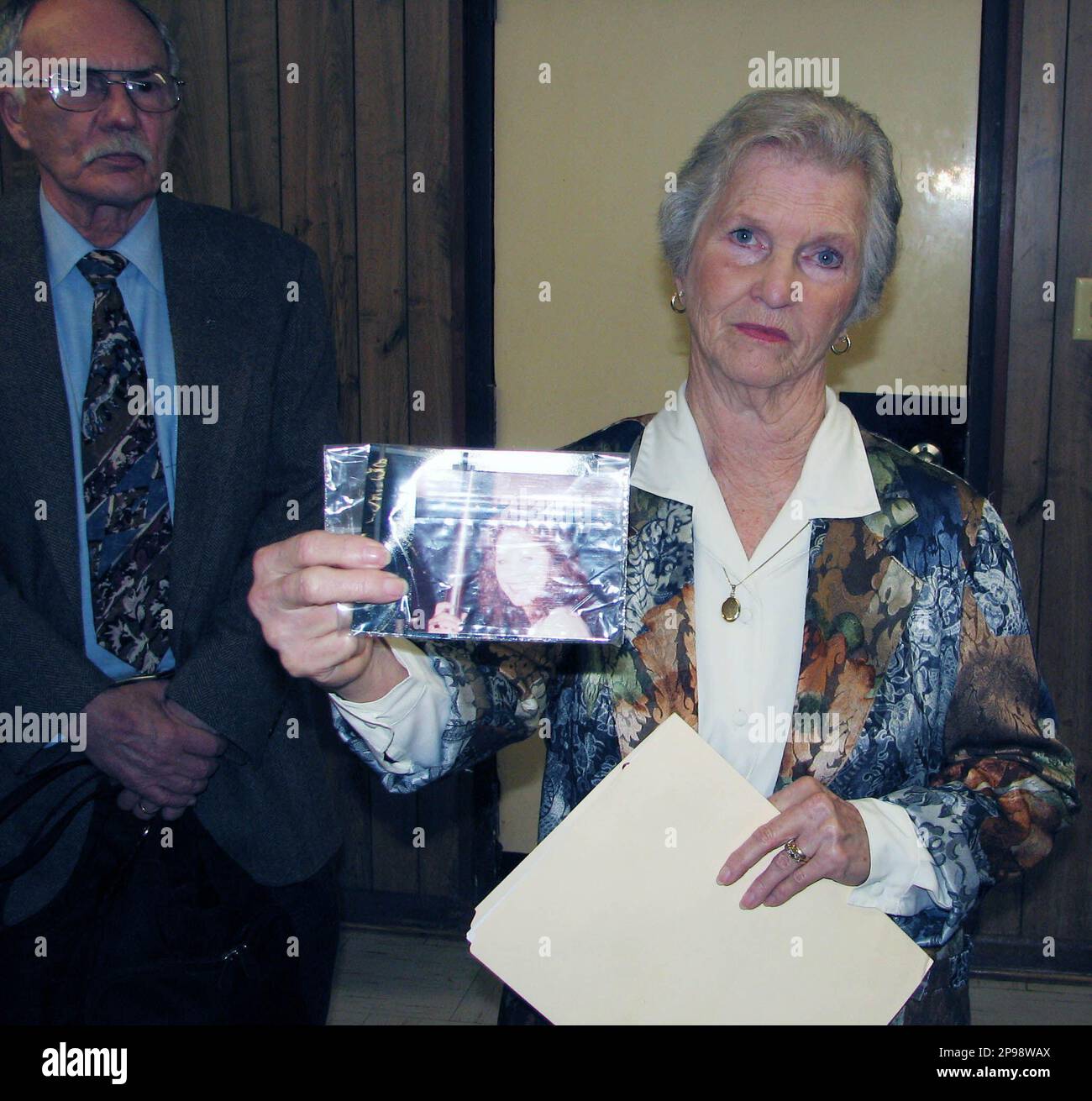 Beth Coheley of Ohatchee, Ala., holds up a photo of her daughter ...