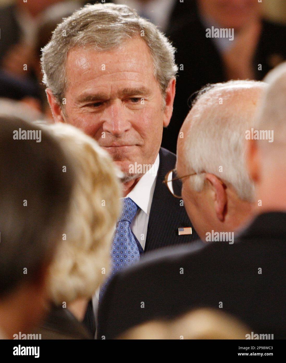 President George W. Bush talks with Vice President Dick Cheney, right ...