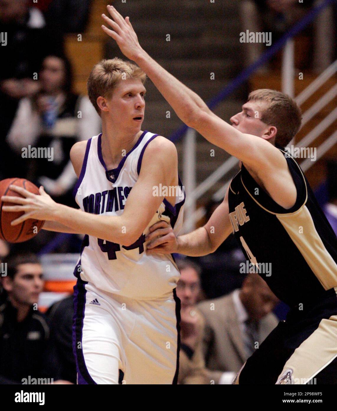 Northwestern's Kevin Coble, left, looks to a pass against Purdue's ...
