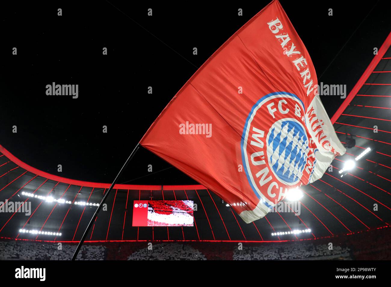 Munich, Germany. 8th Mar, 2023. Flag bearers waves giant FC Bayern ...