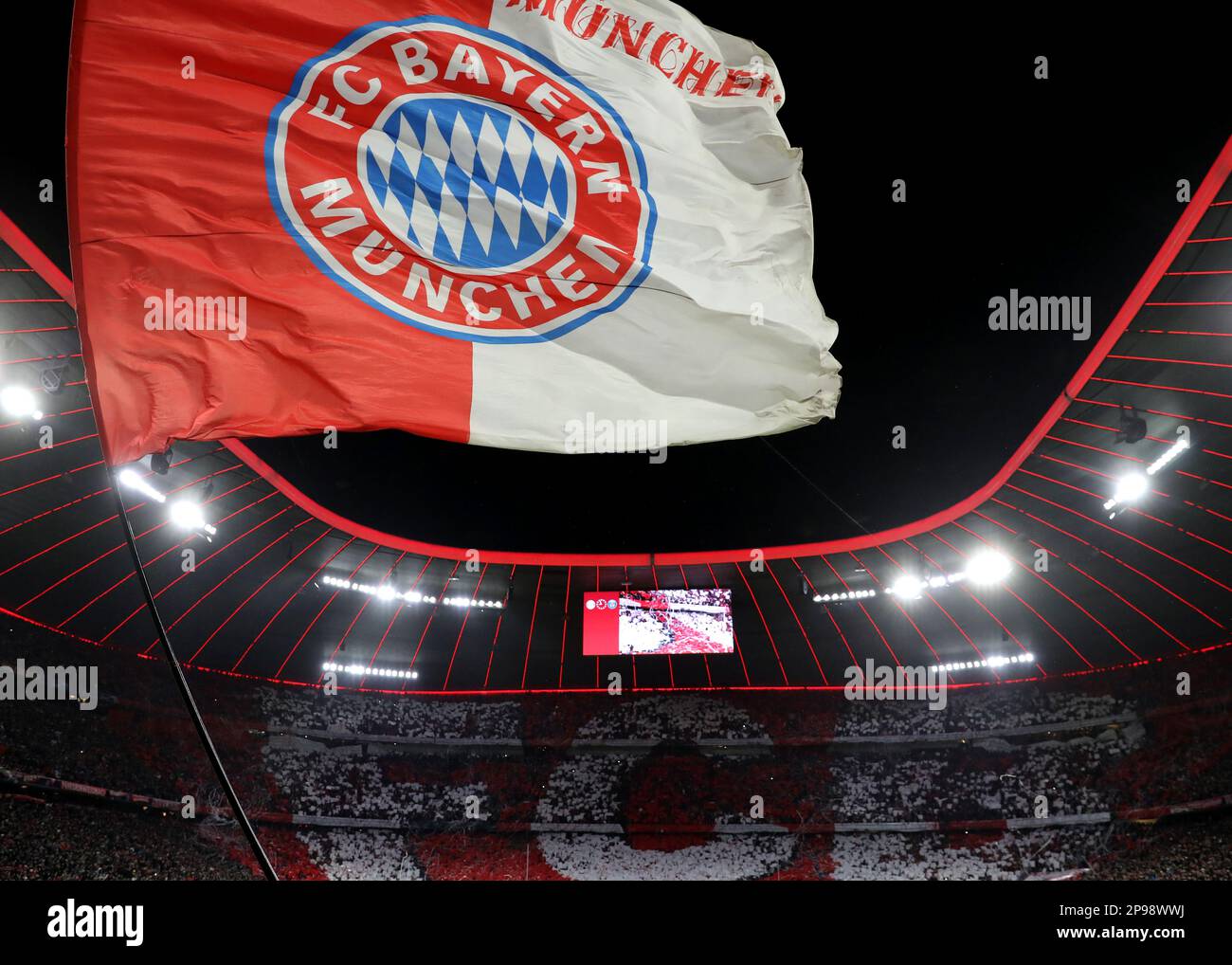 Munich, Germany. 8th Mar, 2023. Flag bearers waves giant FC Bayern ...