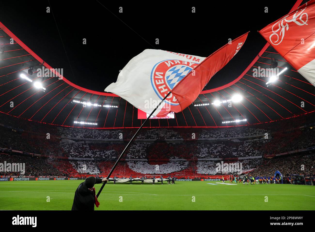 Munich, Germany. 8th Mar, 2023. Flag bearers waves giant FC Bayern ...