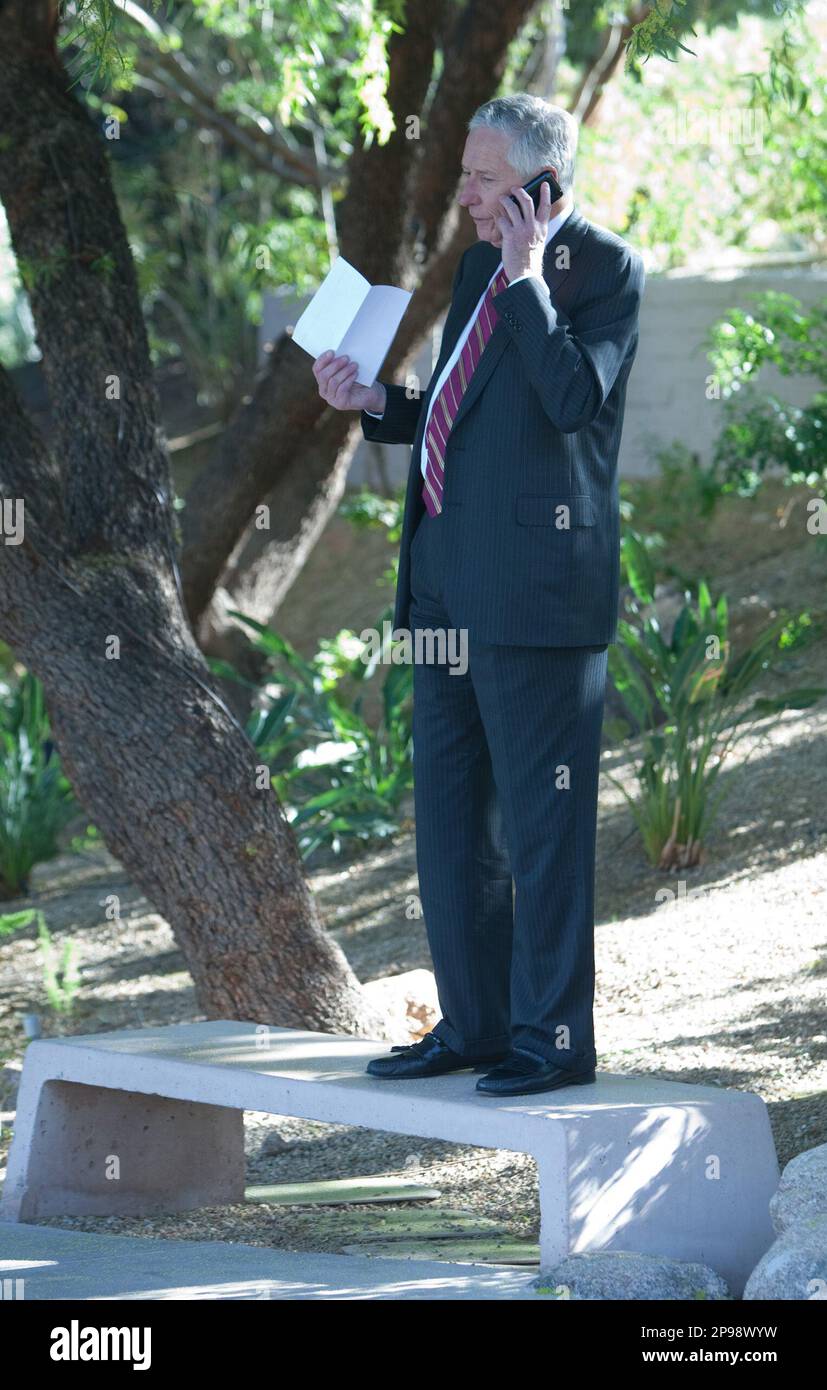 Houston Astros owner Drayton McLane talks on his cell phone outside of ...