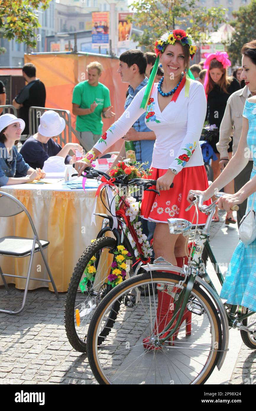 Pretty Ukrainian girl on high heels in red skirt and traditional ...