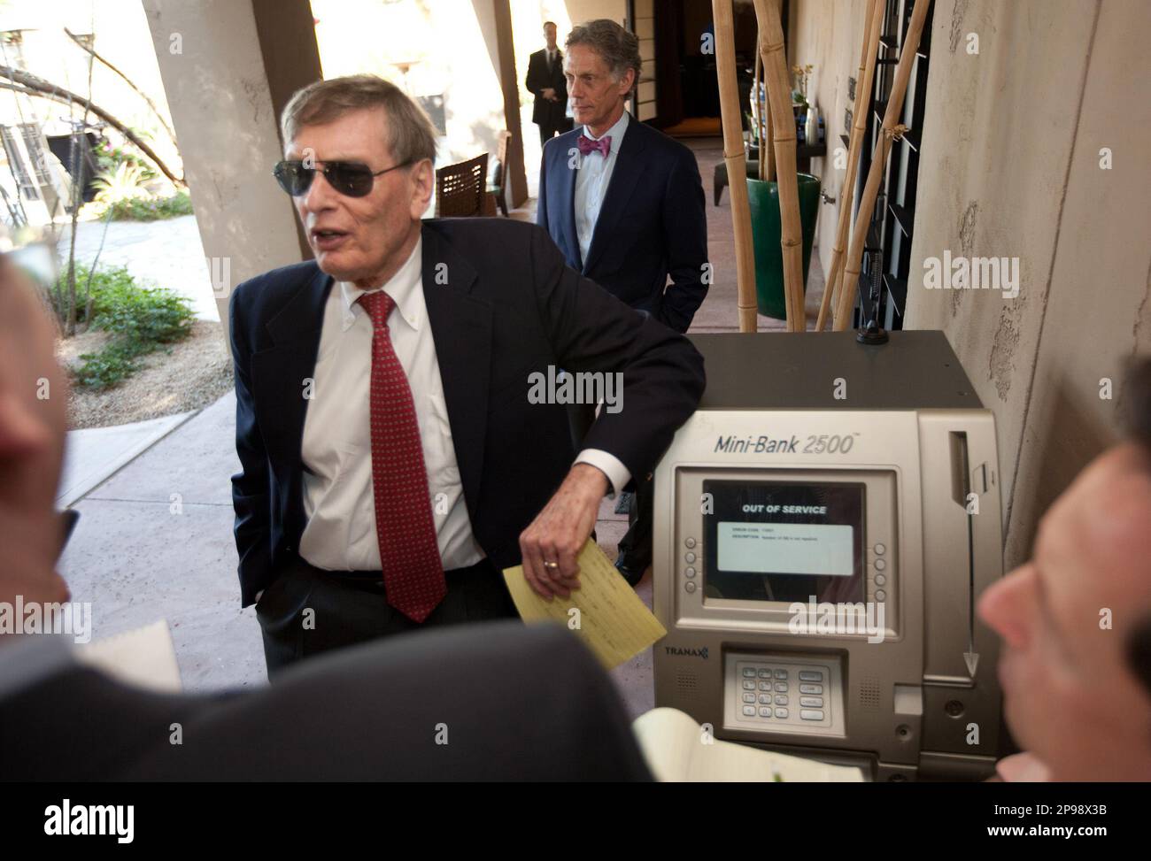 Major League Baseball commissioner Bud Selig leans on an out of service ...