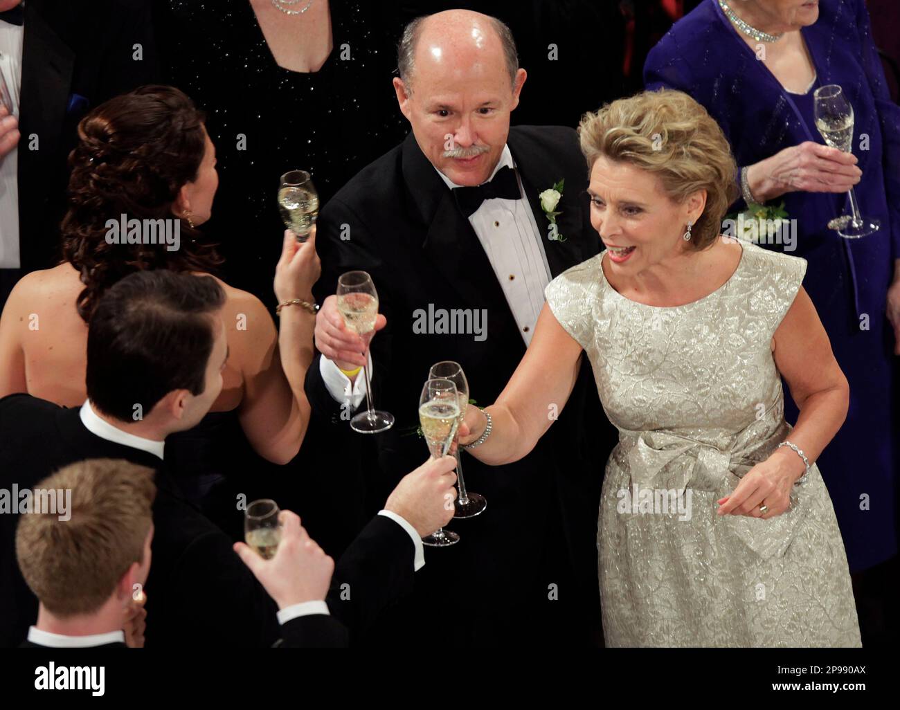 Wash. Gov. Chris Gregoire, right, and her husband Mike toast with their ...