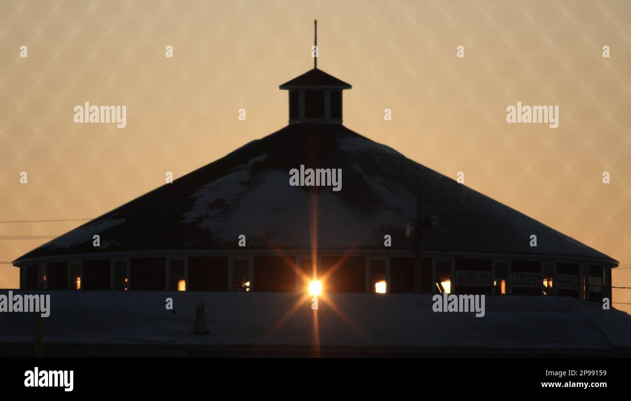 The setting sun shines through two of the upper windows of the World's ...