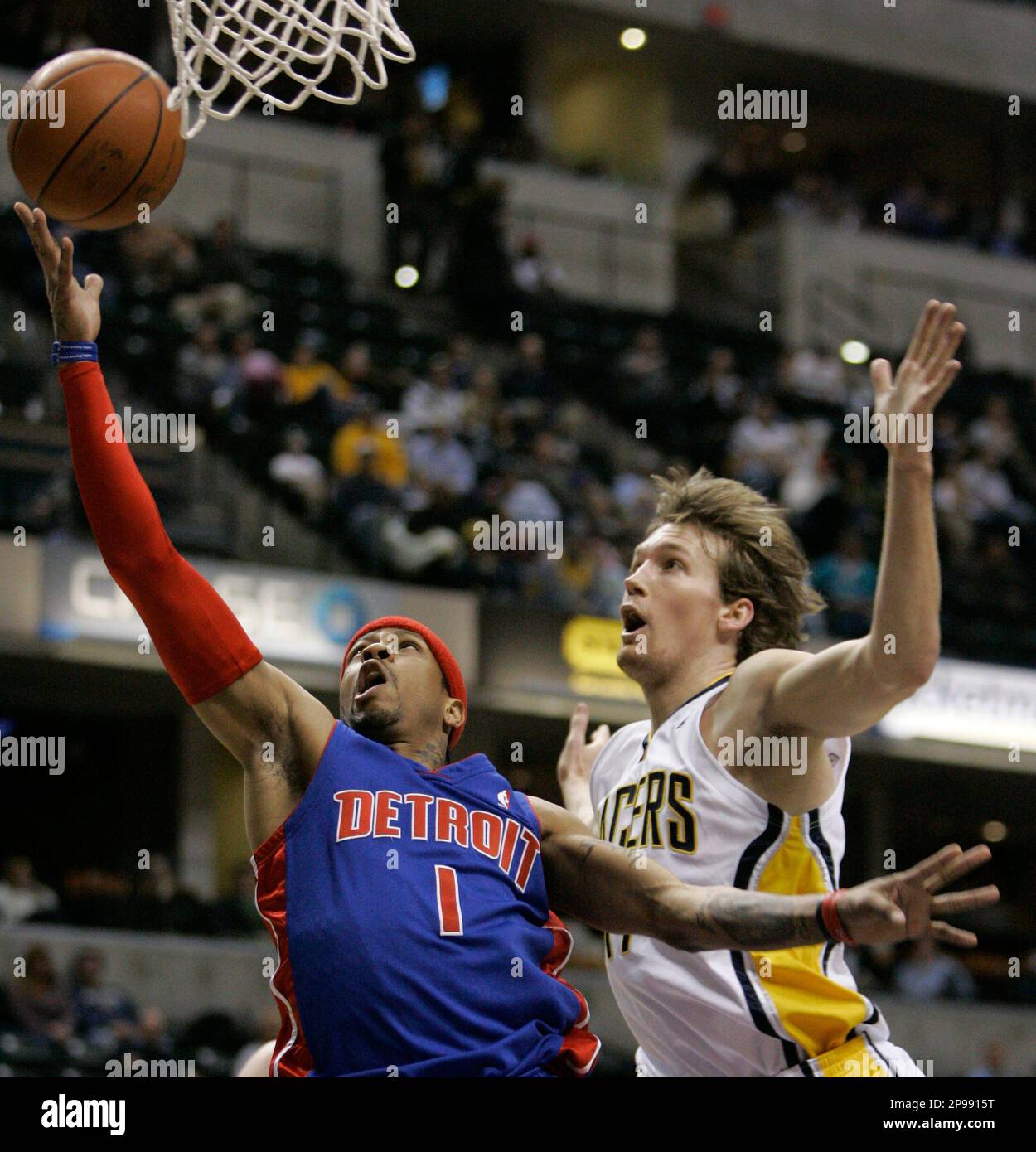 Detroit Pistons guard Allen Iverson, left, puts up a shot against ...