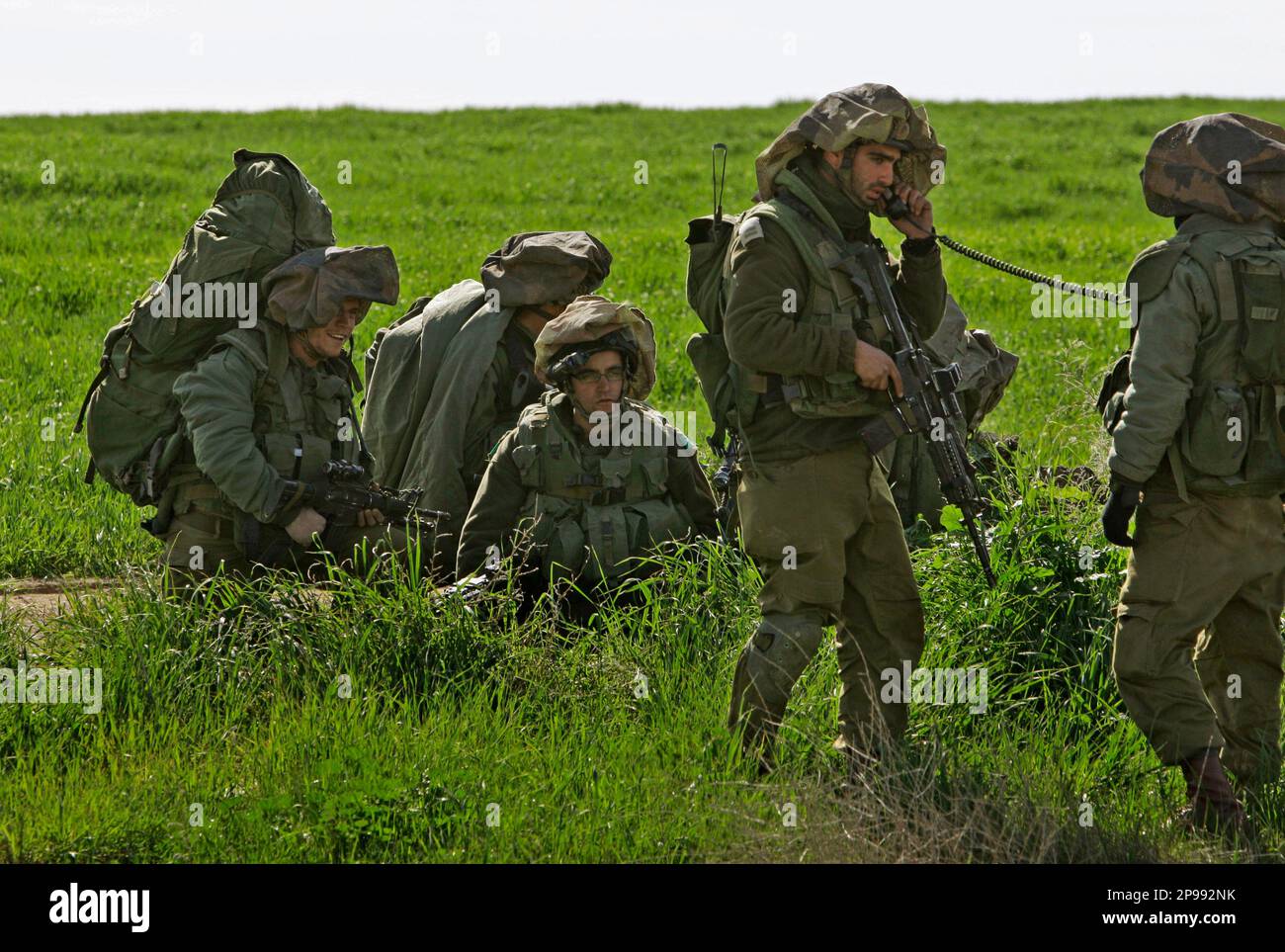 Israeli infantry soldiers gather on the Israel-Gaza border during ...