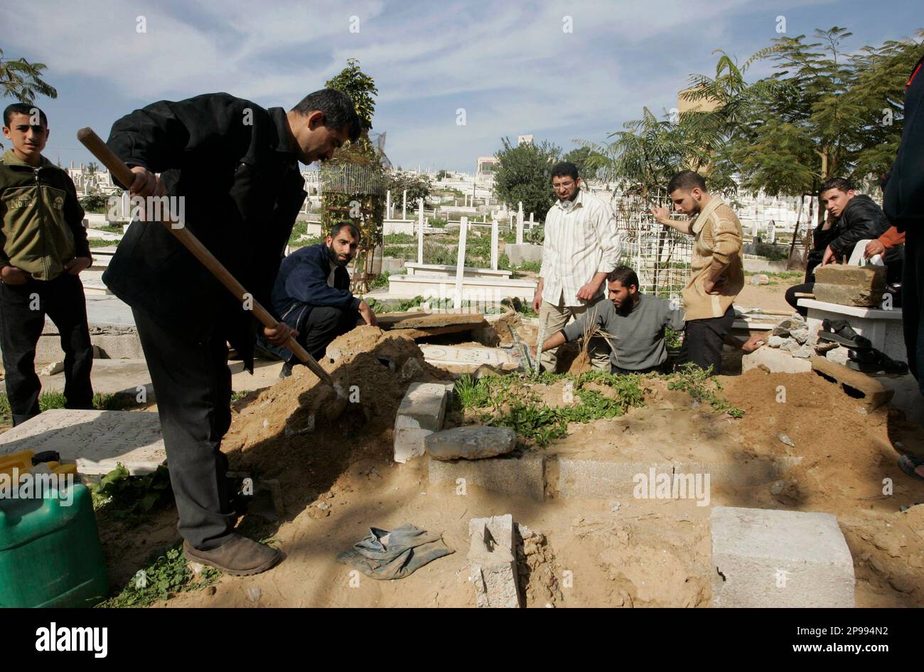 Palestinian Salim Sarhi, third left, and Hisham Sarhi, third from right ...