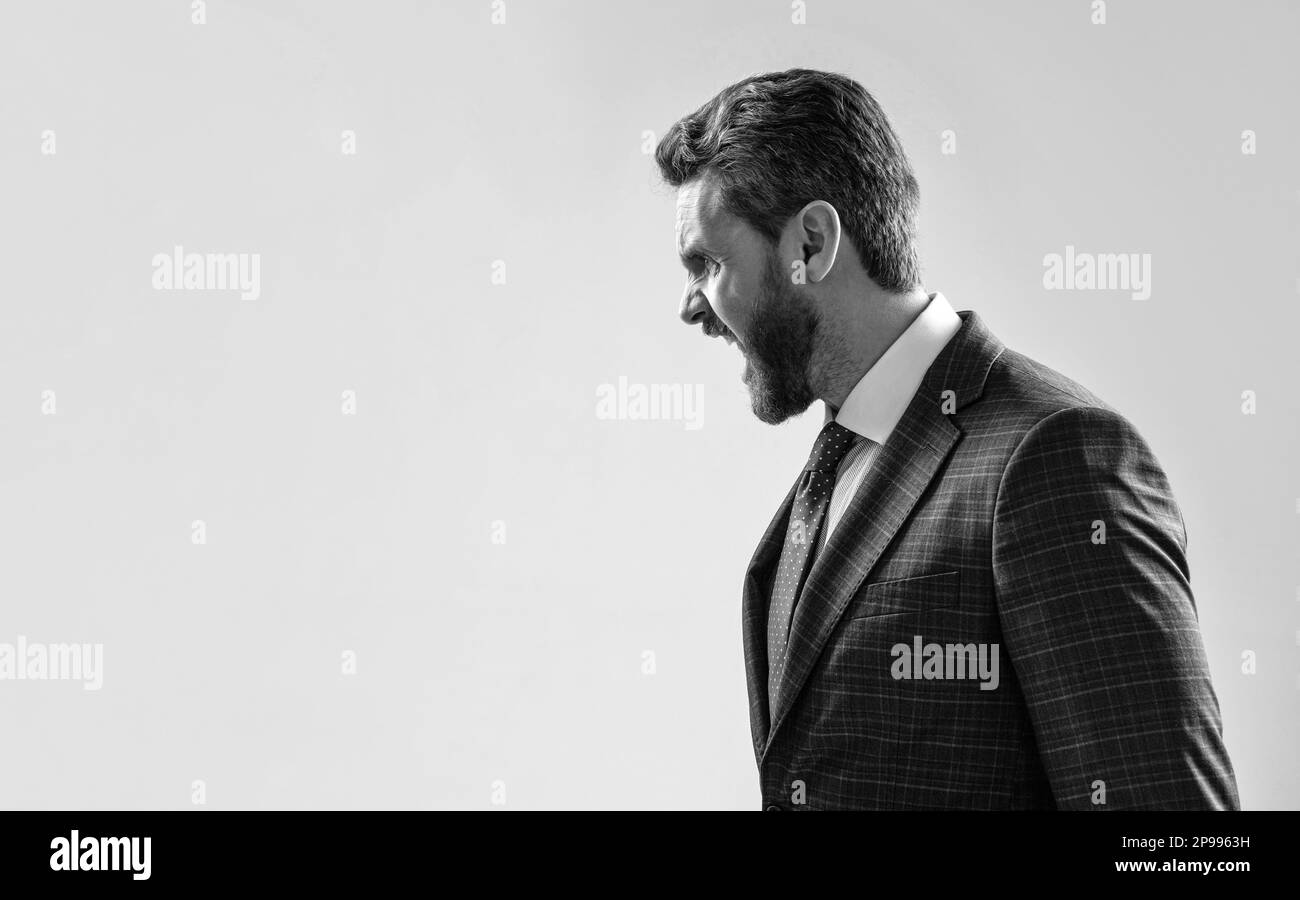 You make me yell. Angry guy side-face yell grey background. Businessman ...