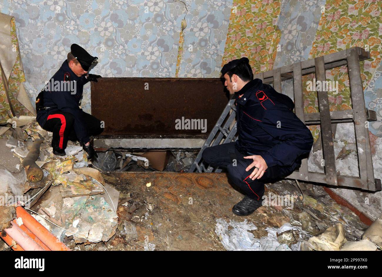 Italian Carabinieri paramilitary police officers look at a passage in a ...