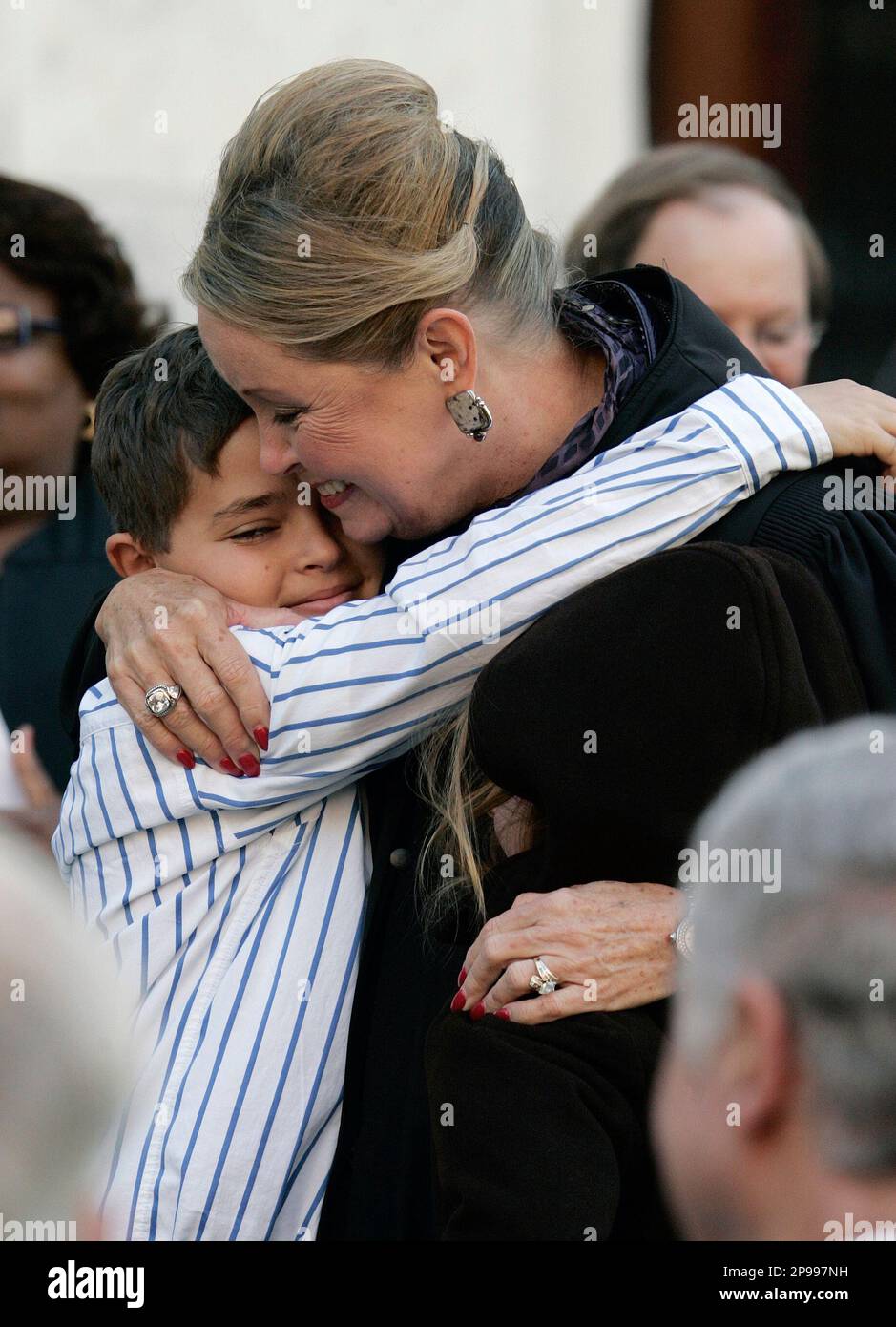Chief Justice Catherine D. "Kitty" Kimball hugs her grandchildren at ...