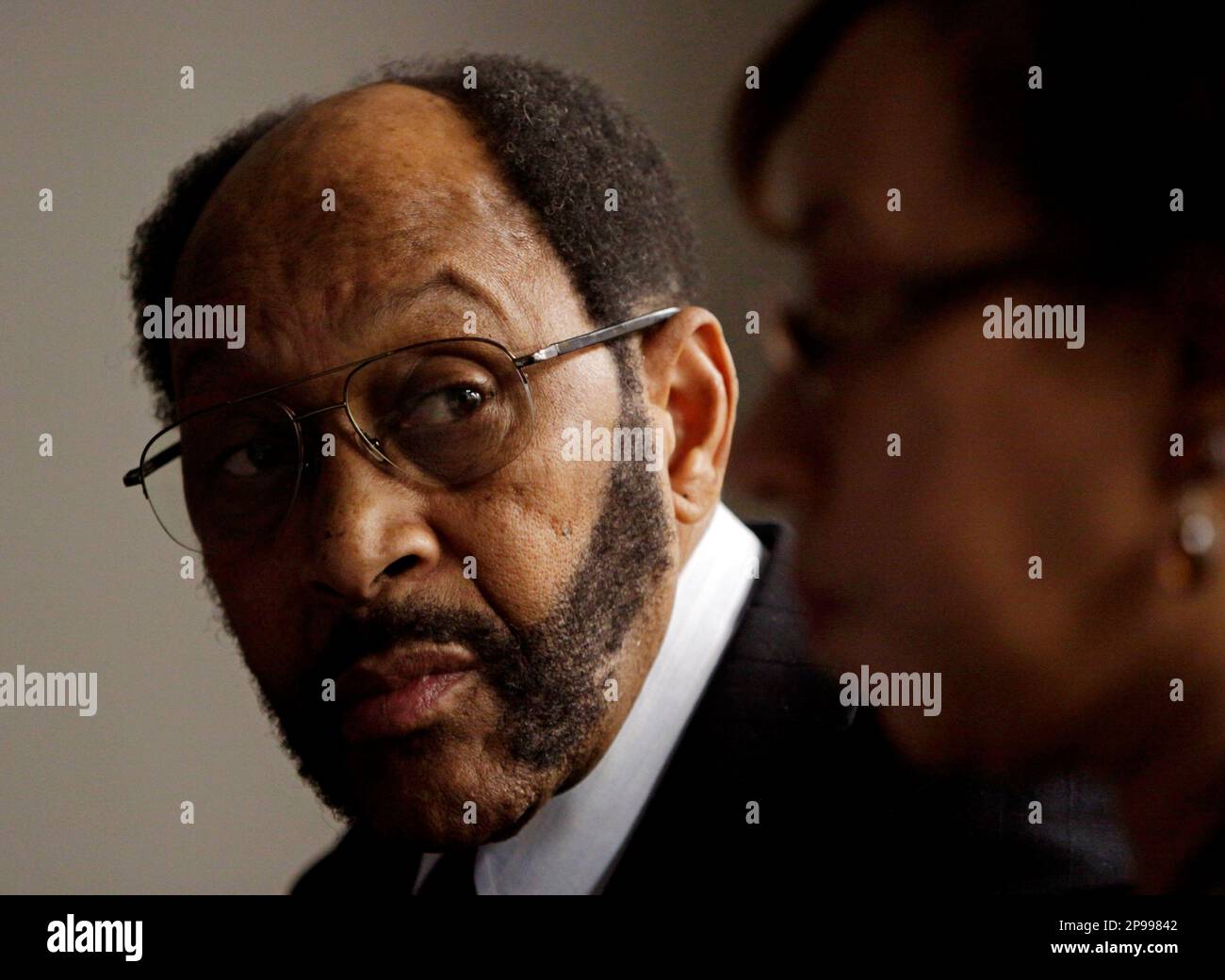 Gary, Ind., Mayor Rudy Clay, left, listens as Celita Green speaks ...