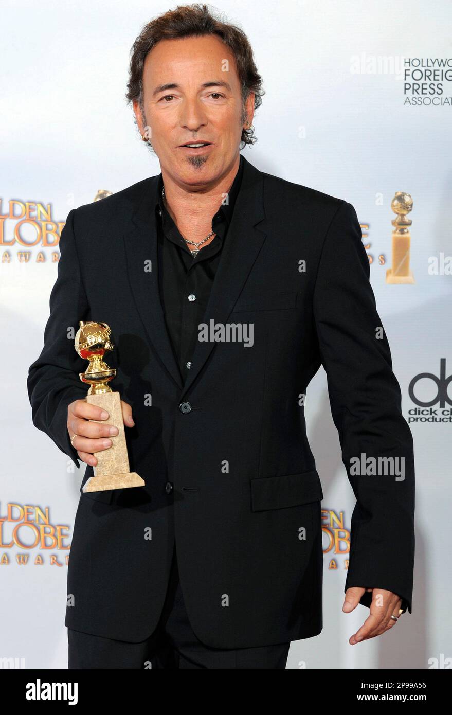 Bruce Springsteen poses with his award for music and lyrics from the ...