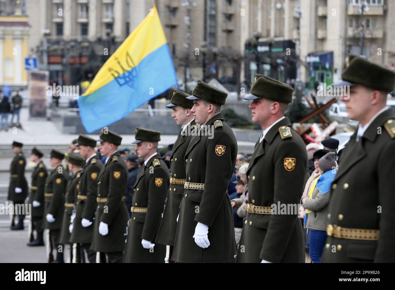 Ukrainian soldiers of a honor guard stand in a line during a memorial ...