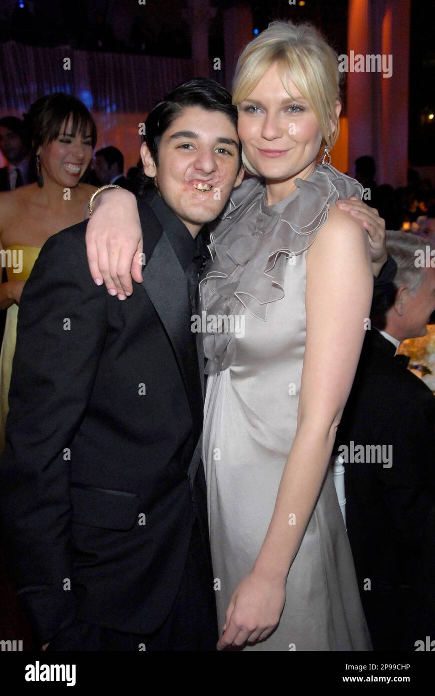 Actress Kirsten Dunst, right, poses with David Anguiano at a benefit ...