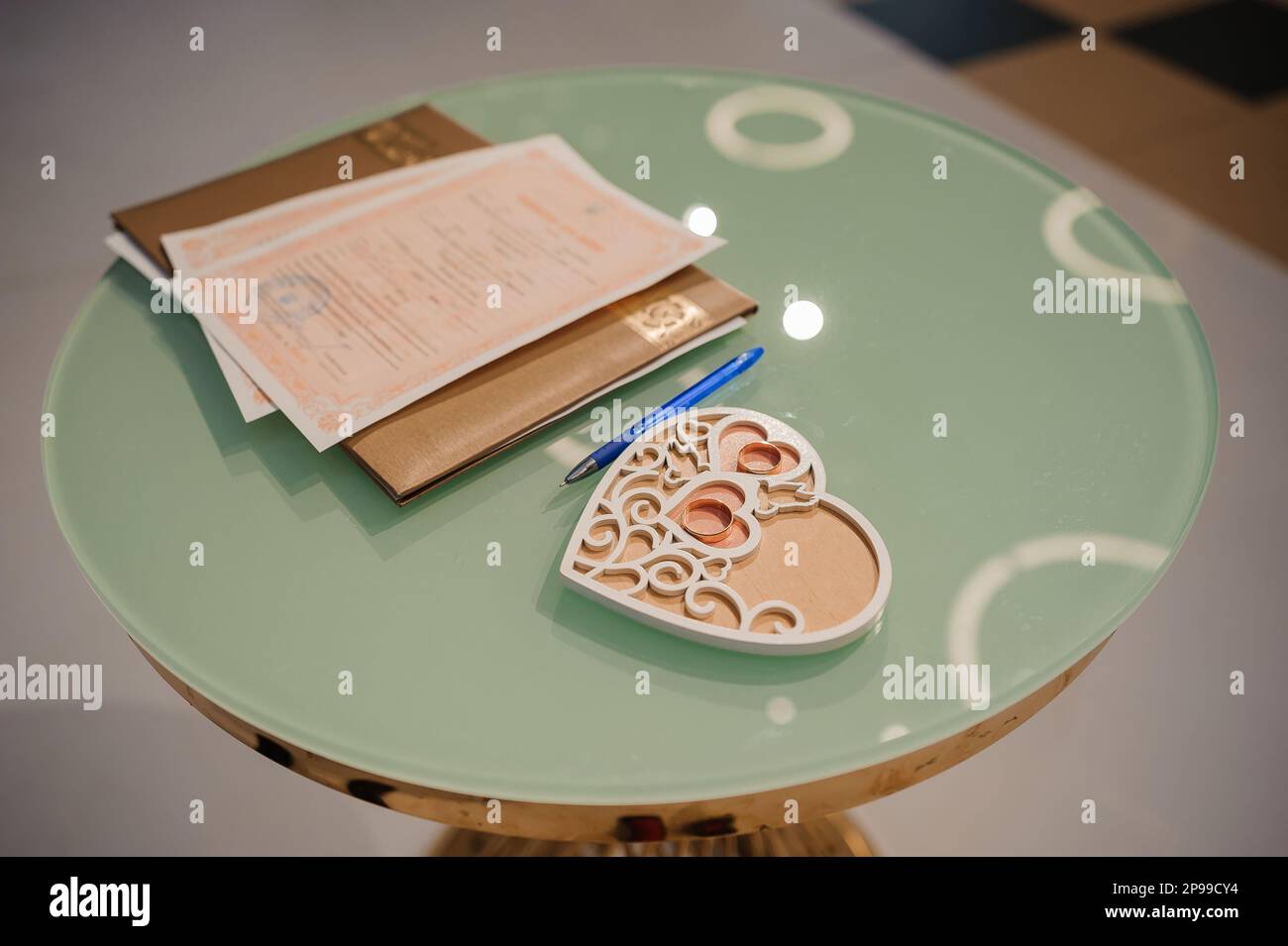 Wedding ring with blue ribbon hi-res stock photography and images - Alamy