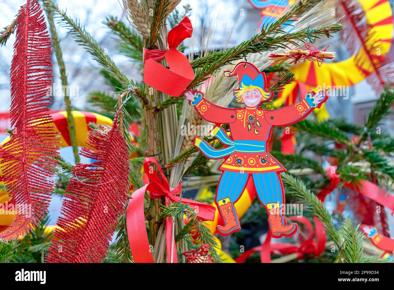 Figurine of a buffoon in an old Russian outfit against the background ...