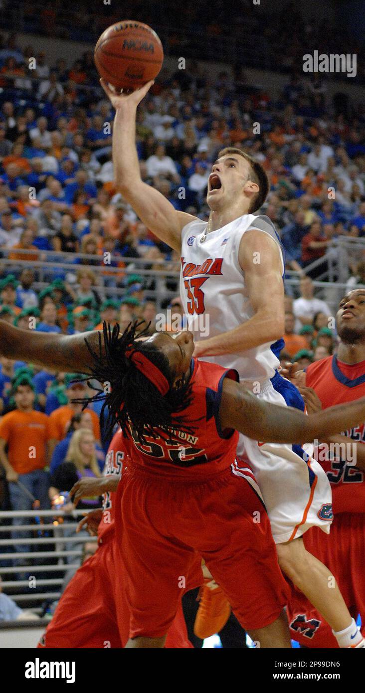 Florida's Nick Calathes (33) shoots over Mississippi's DeAundre ...