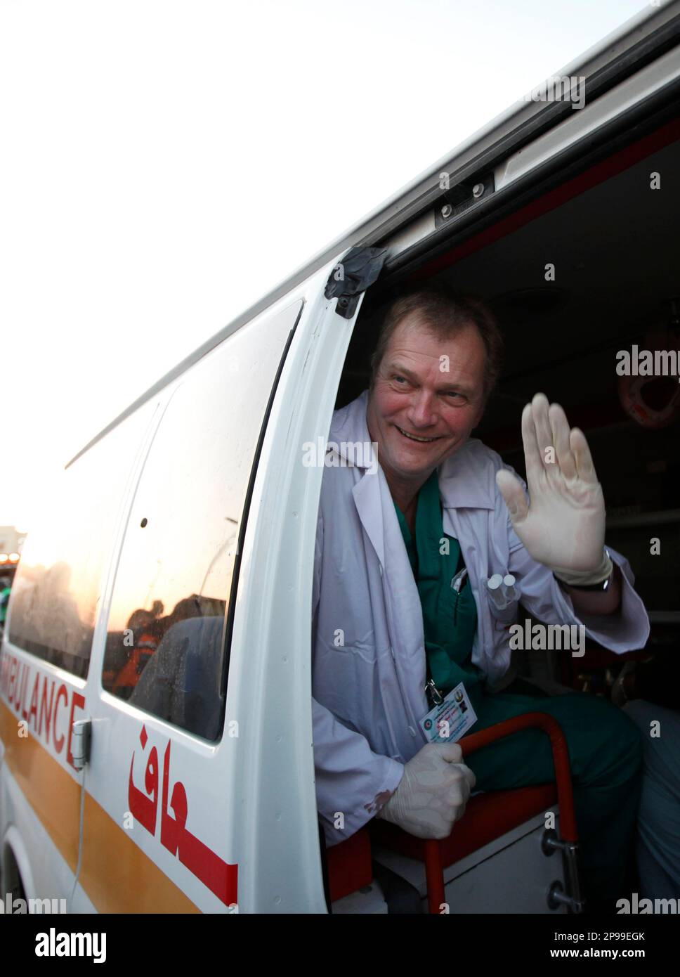 Norwegian doctor Eric Fosse waves from a Palestinian ambulance arriving ...