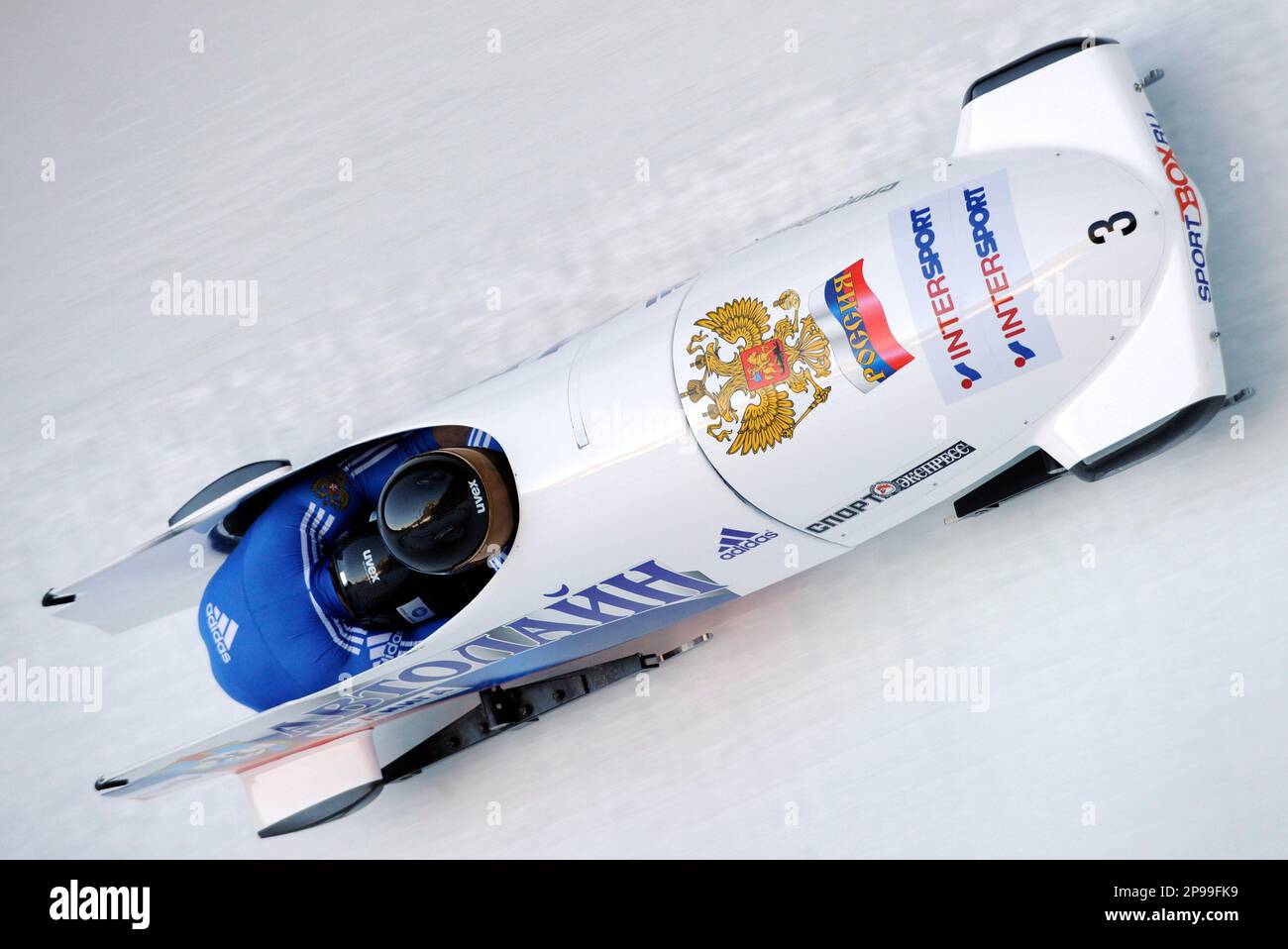 Alexandr Zubkov, right, and Alexey Voevoda from Russia speed down the ...