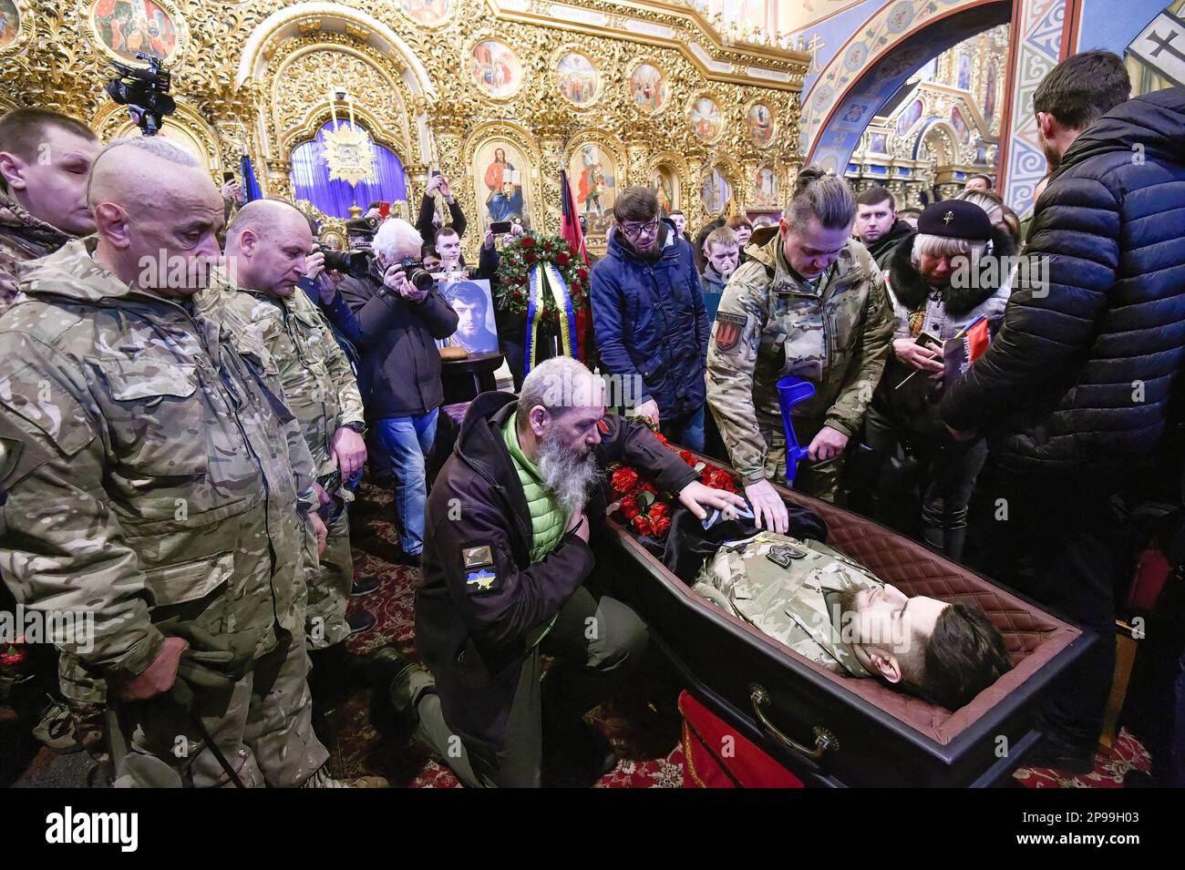 (EDITOR'S NOTE: Image depicts death) People pay their respect around ...