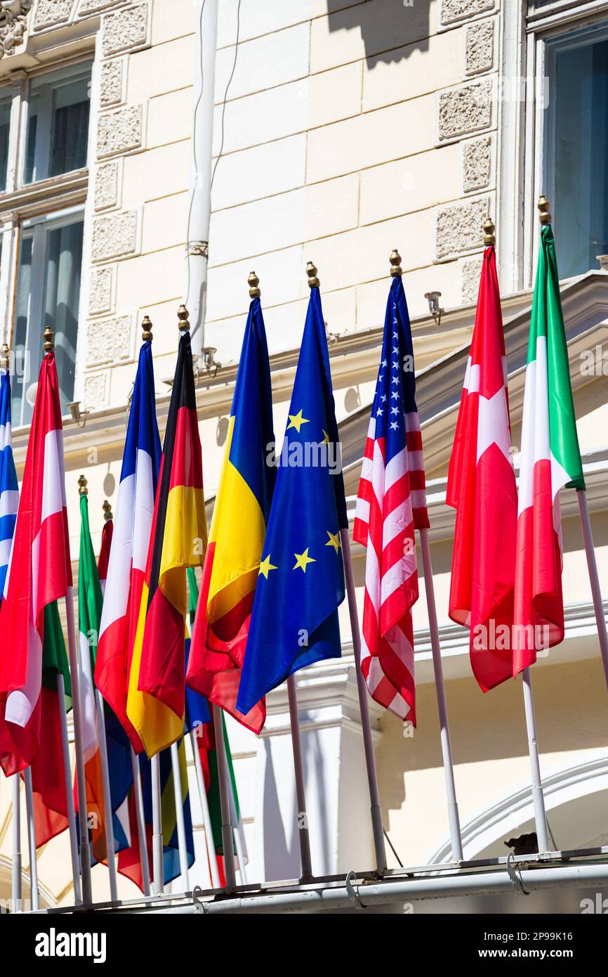 Many flags of the world on the facade of a historic building Stock ...