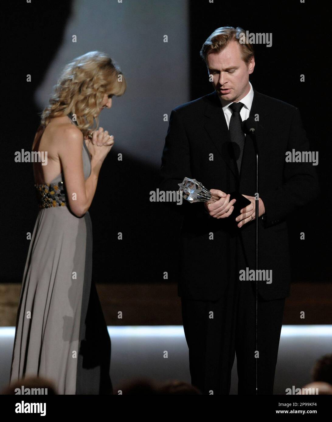Director Christopher Nolan accepts the best supporting actor award for ...