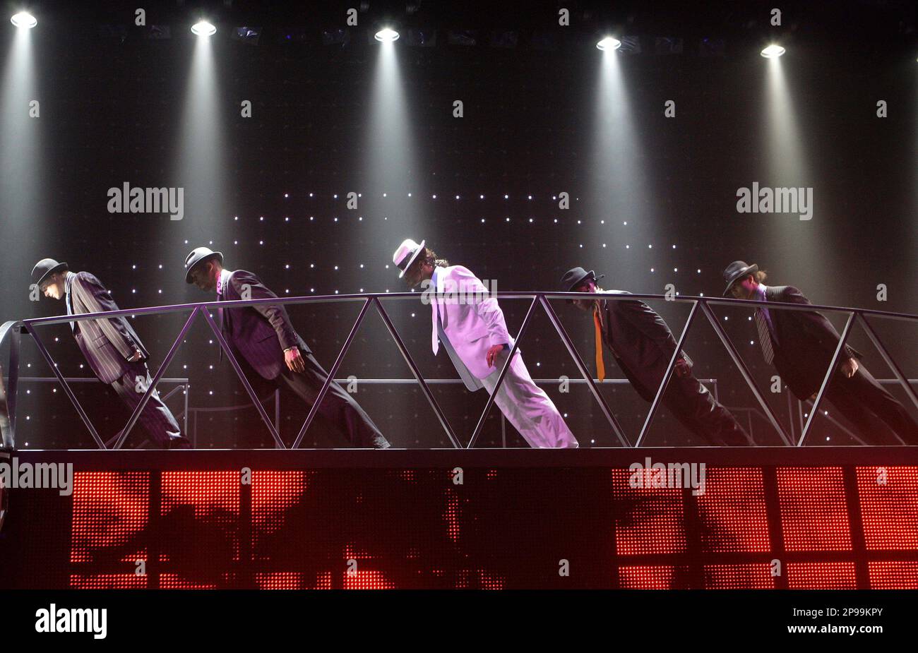 British performer Ricko Baird, centre, and cast members perform a scene ...