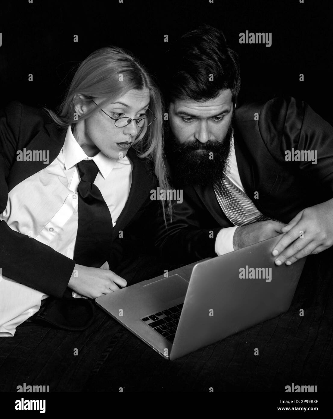 Two business partners working with laptop together. Professional man ...