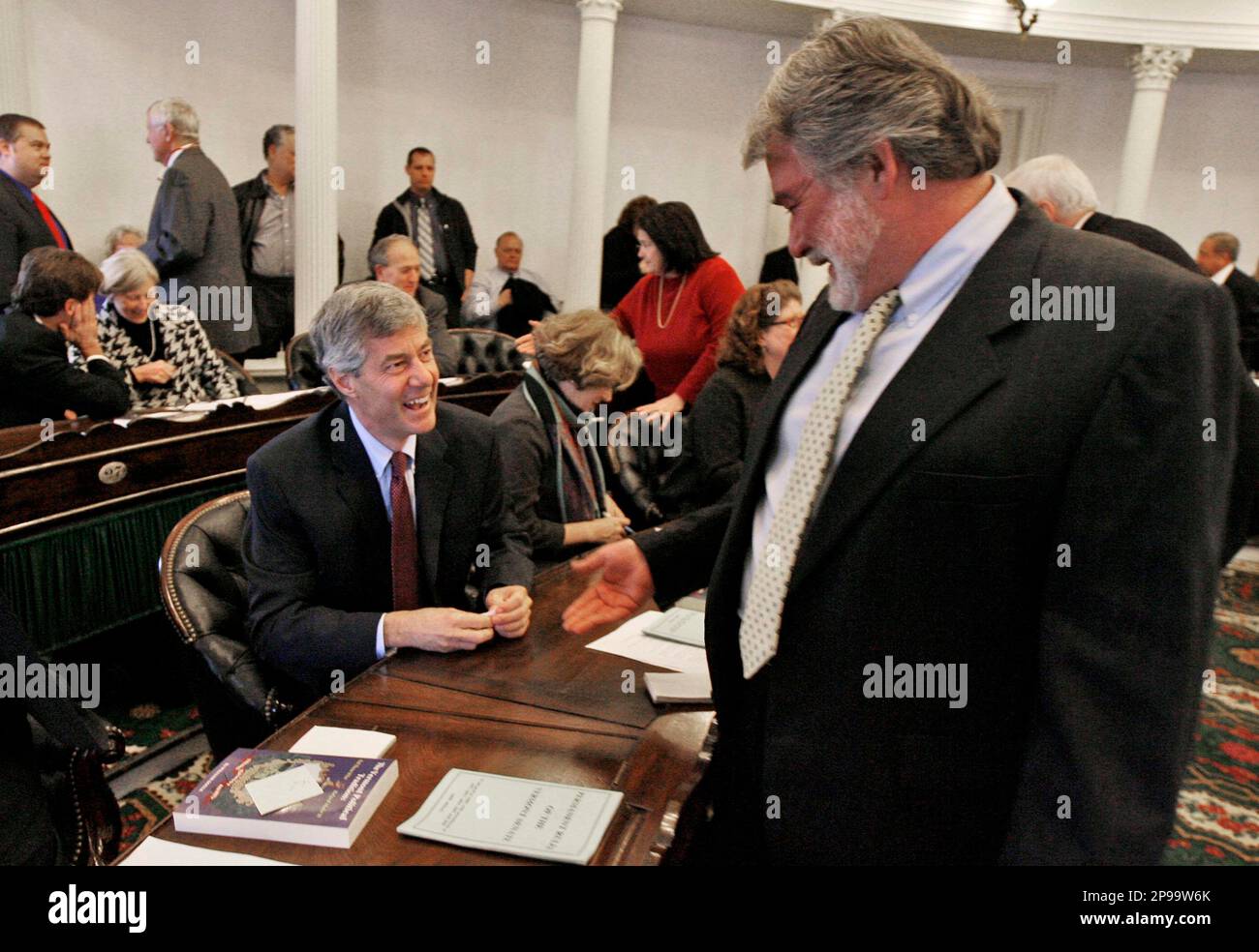 Sen. Doug Racine, D-Chittenden, center left, greets Sen. Dick McCormack ...
